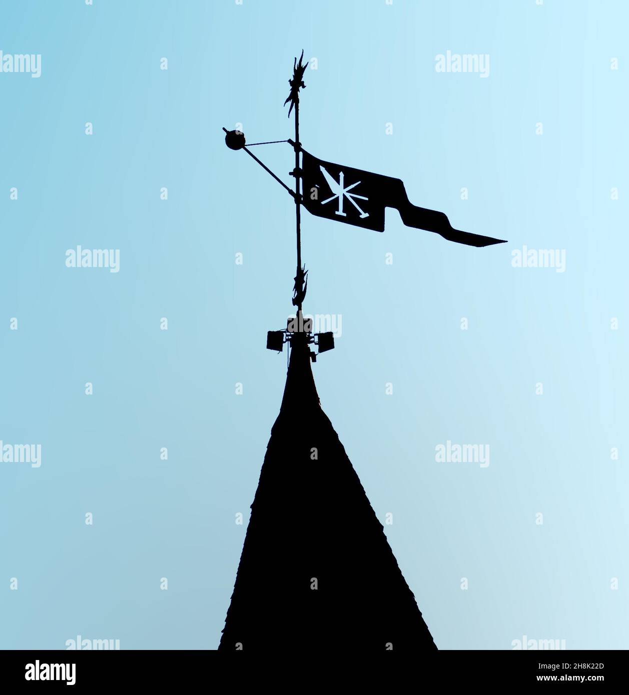 Weather vane with a flag and an emblem, standing on one of the European ...