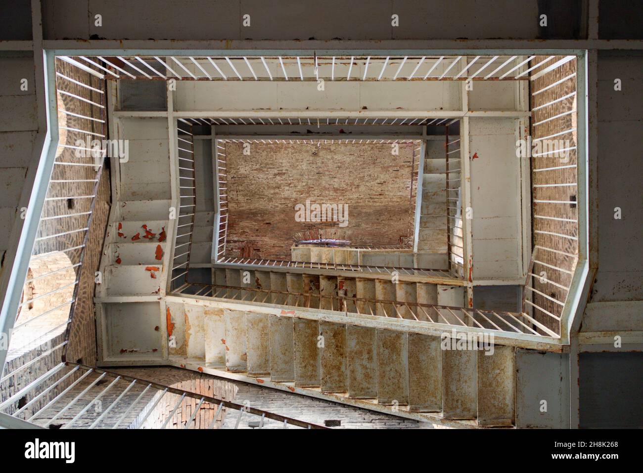 Rusty staircase in an old stone tower from below Stock Photo - Alamy