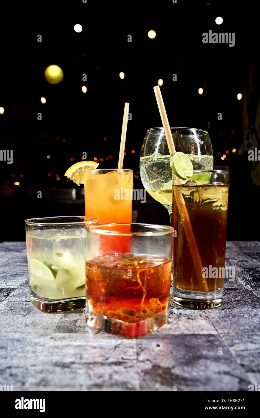cocktail in a transparent glass with a starry black background, various ...