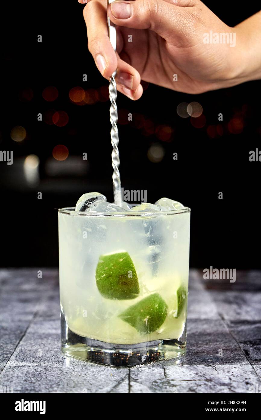 cocktail in a transparent glass with a starry black background, various ...