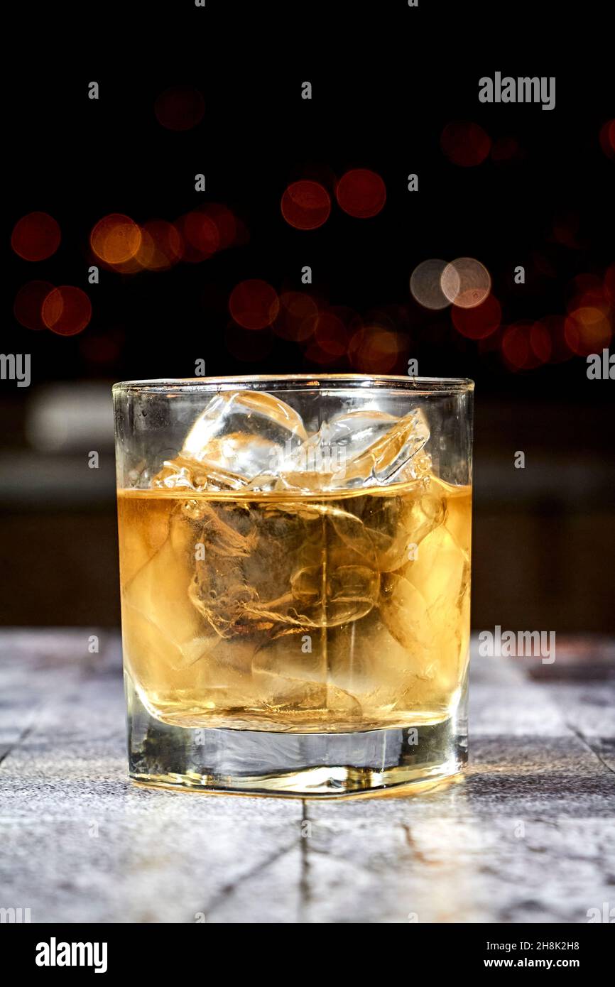 cocktail in a transparent glass with a starry black background, various ...