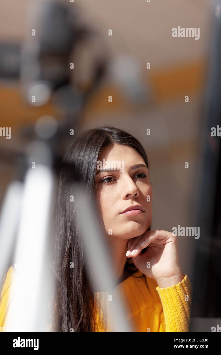 Beautiful girl talking in front of a camera, recording herself. Video ...