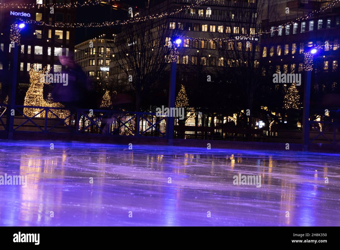 Winter in Stockholm. Ice skating in the square in Kungstradgarden Stock ...