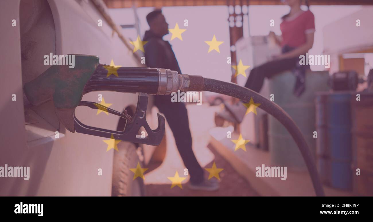 Multiple exposure of european union flag with pump fueling vehicle ...