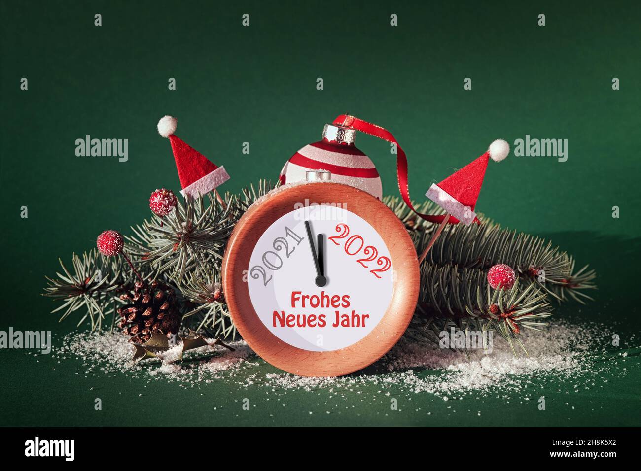 Countdown to midnight. Wood alarm clock with new year 2022. Red baubles ...