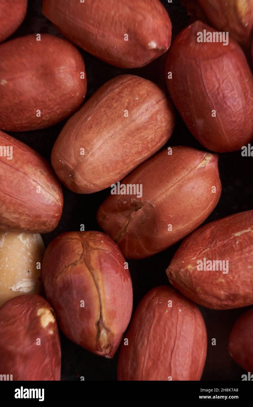 peanuts on black background. Healthy food session Stock Photo - Alamy