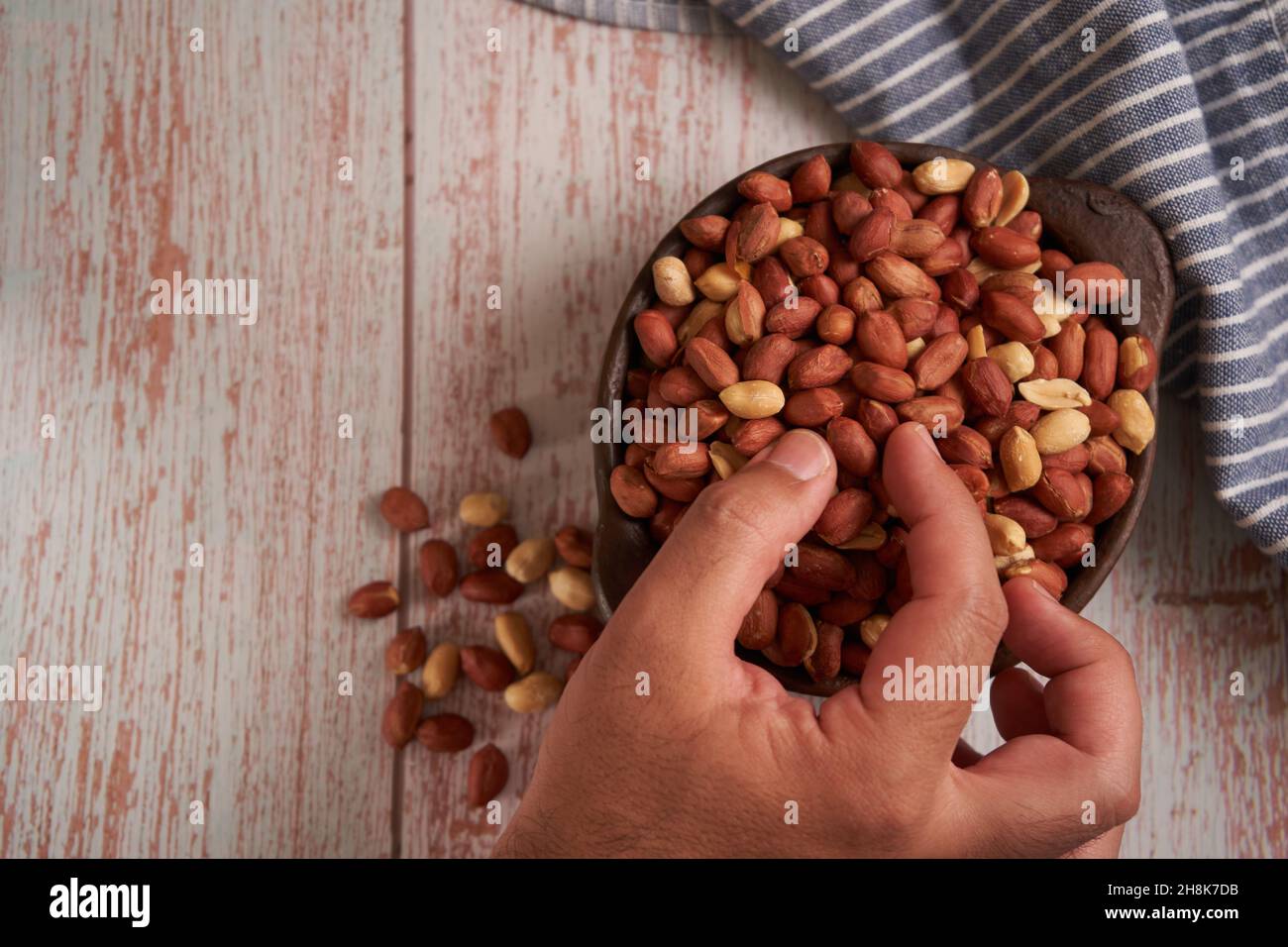 Peanut on wooden pot hi-res stock photography and images - Alamy