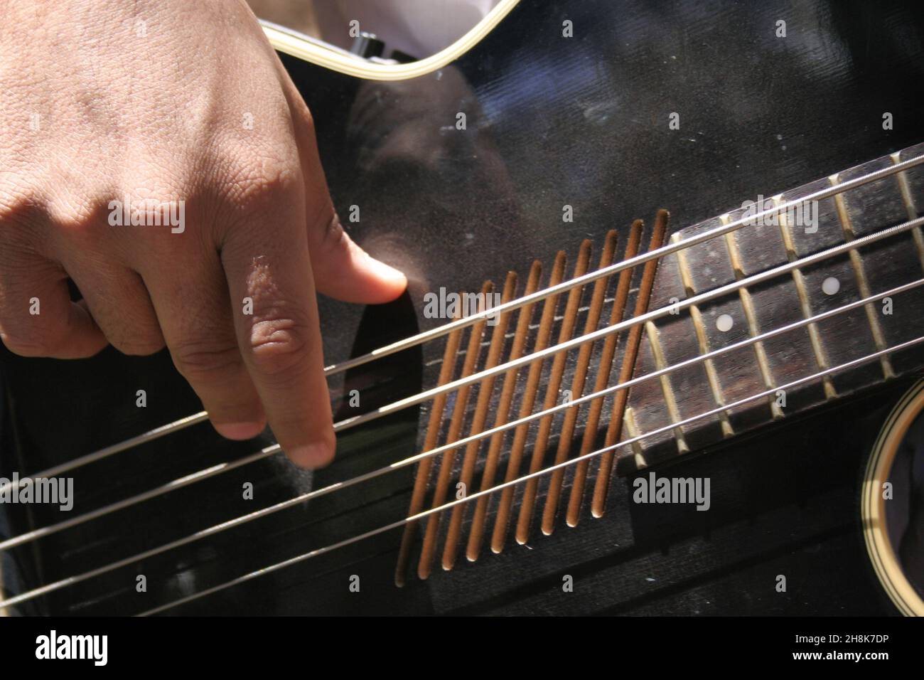 Shallow focus shot of a person playing the guitar Stock Photo - Alamy