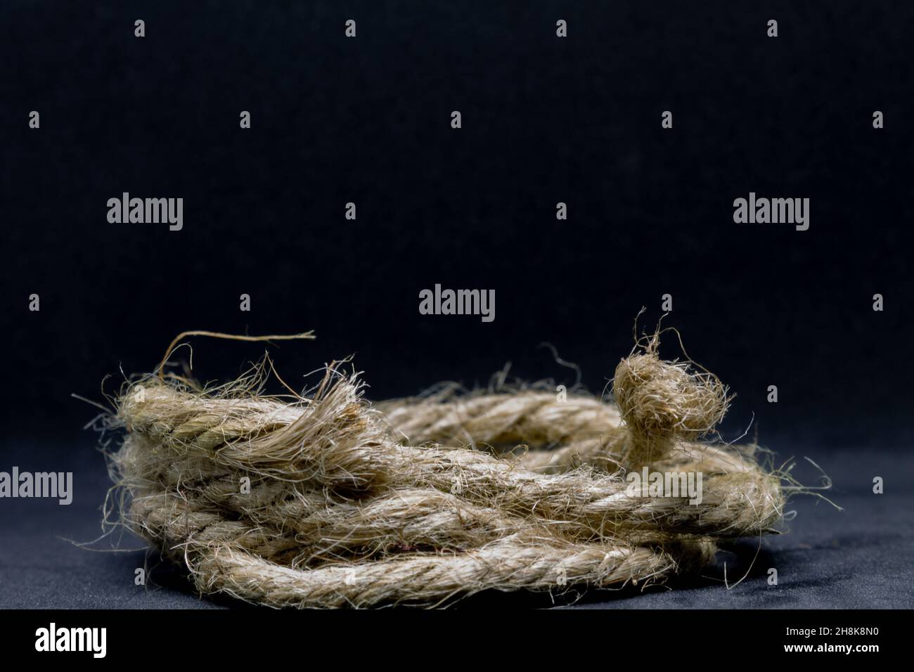 Closeup shot of a braided rope isolated on a black background Stock ...