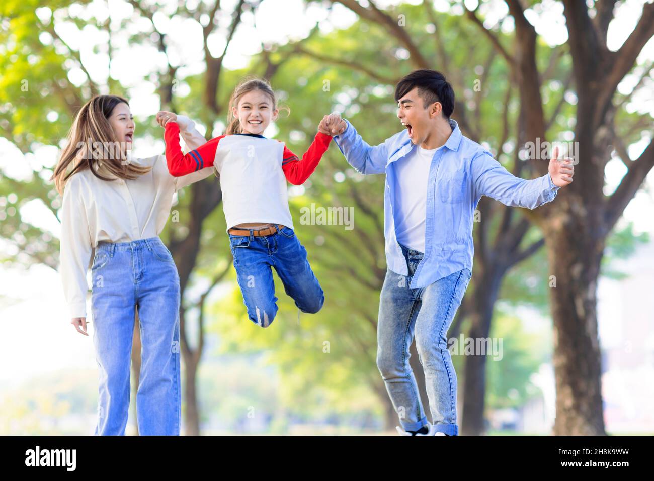 Happy jumping family hi-res stock photography and images - Alamy