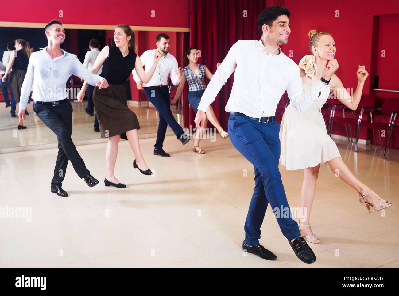 Couples enjoying active boogie-woogie Stock Photo - Alamy