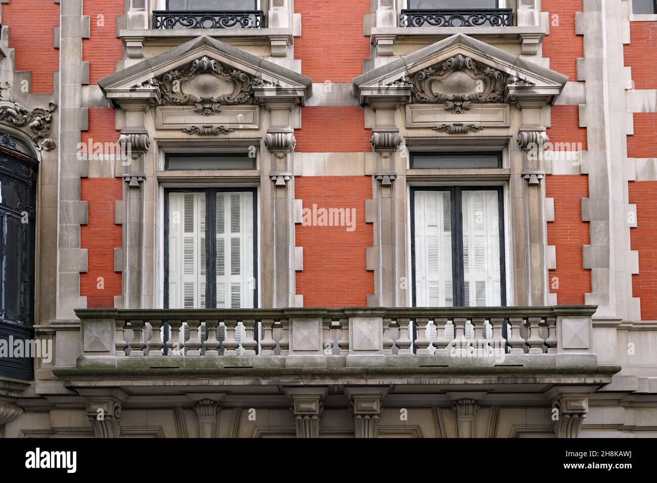 Old apartment building or townhouse with elegant stone balcony and ...