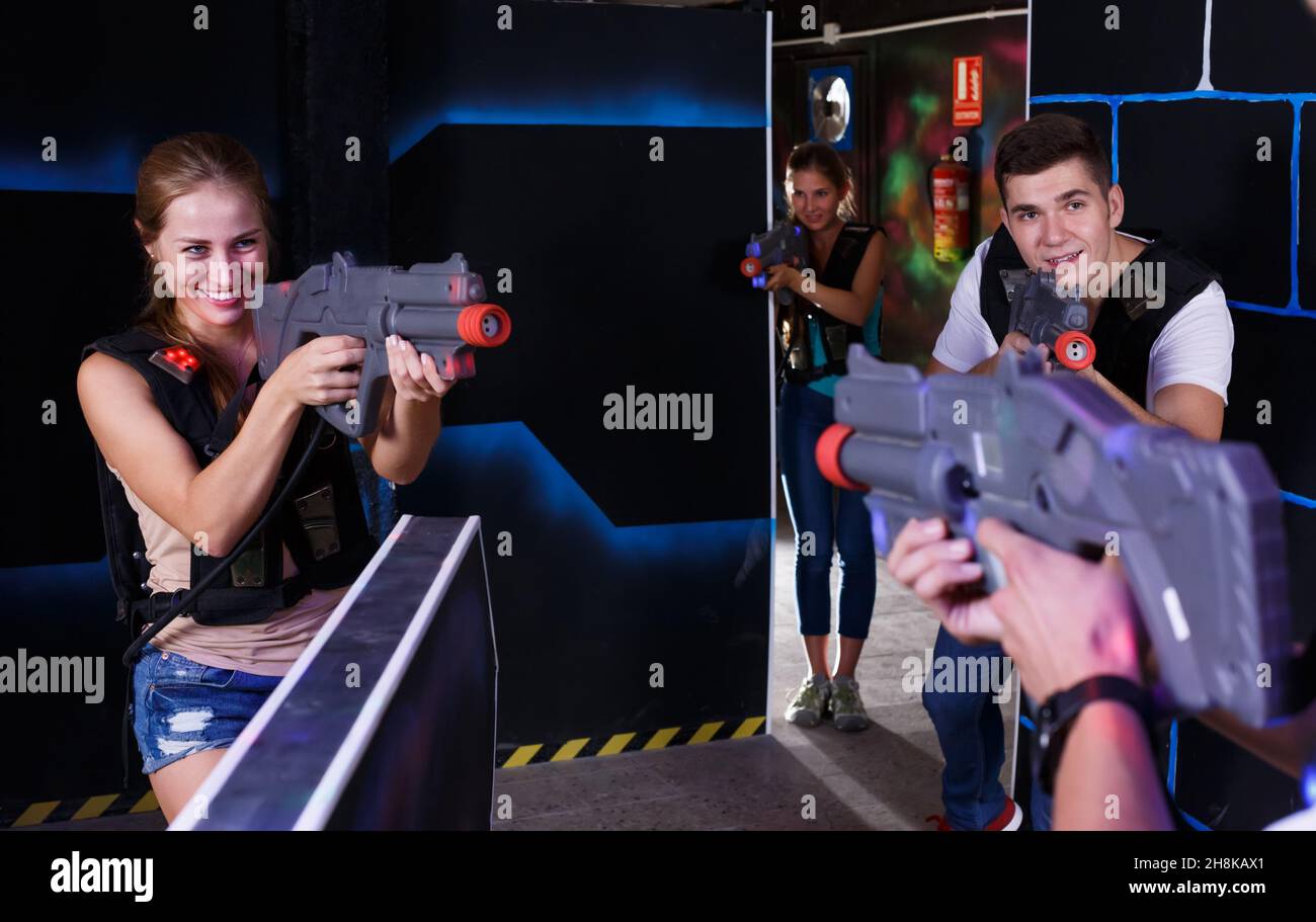 team of players aiming from laser pistols Stock Photo - Alamy