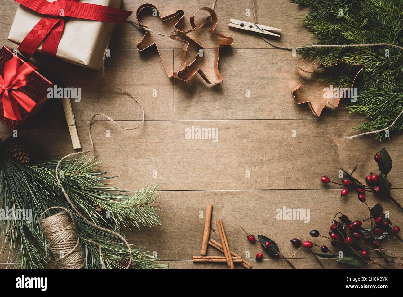 Rustic Christmas frame on a wood background with copper cookie cutters ...