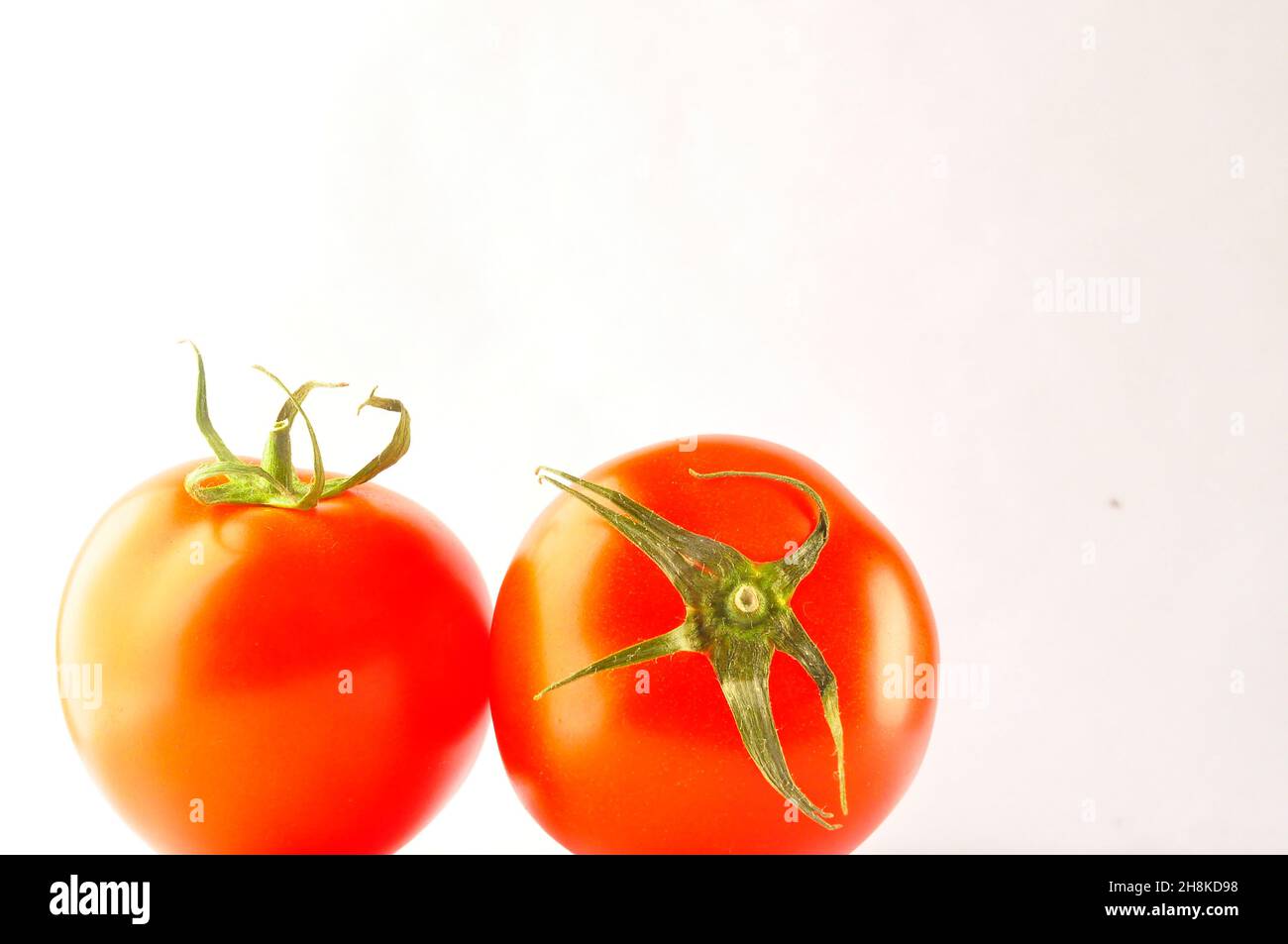 Tomato on white background Stock Photo - Alamy