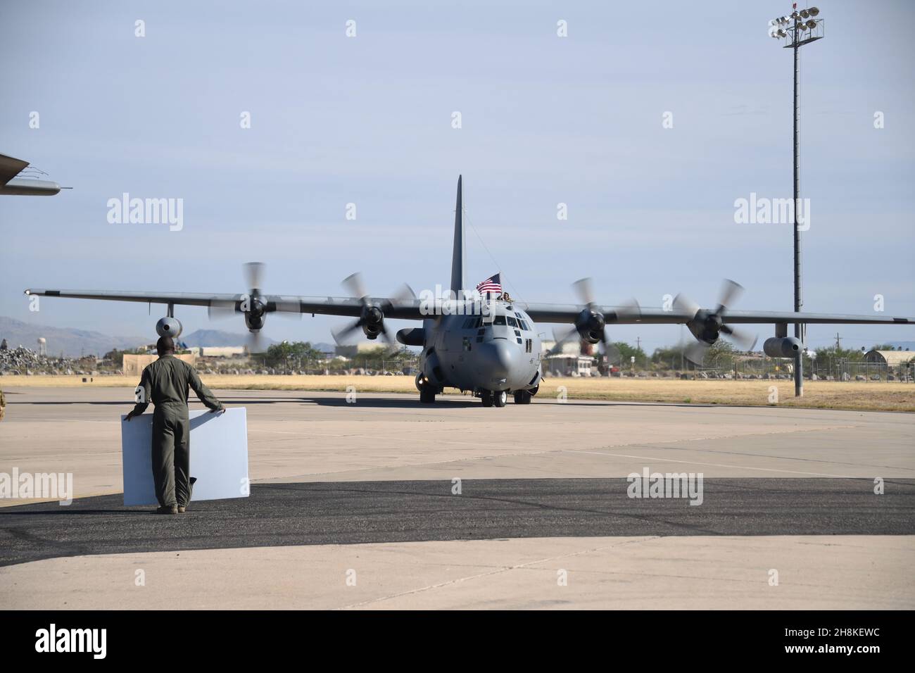 An Aiman from the 41st Electronic Combat Squadron waves the American ...