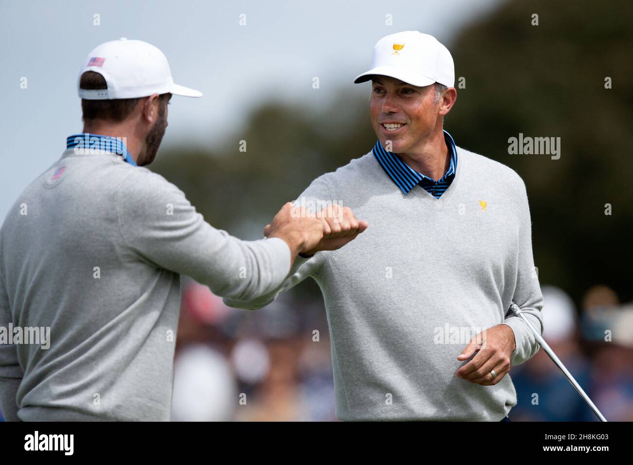 Dustin Johnson of team USA and Matt Kucher of team USA fist pump after ...