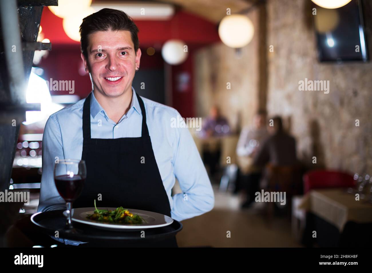 Waiter holding food tray hi-res stock photography and images - Alamy
