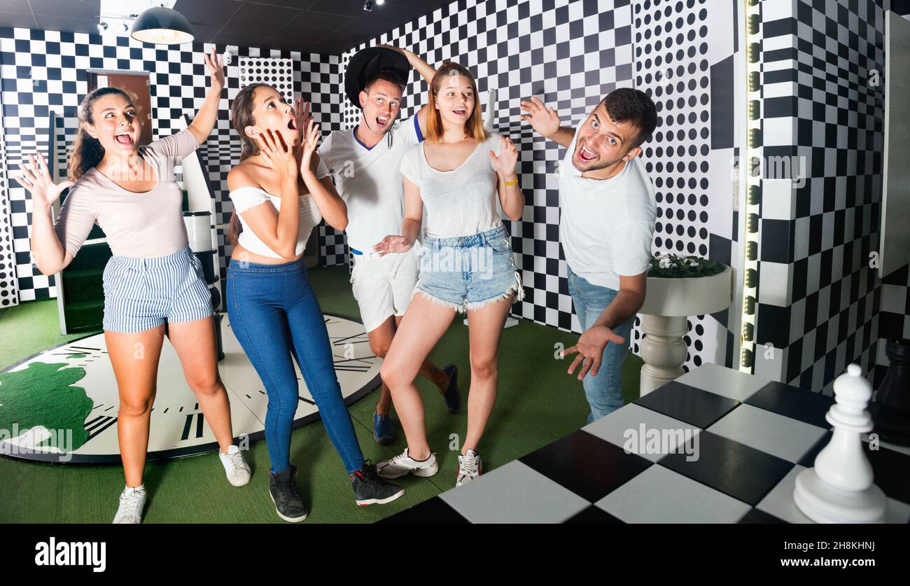 Group of young people having fun in escape room Stock Photo - Alamy