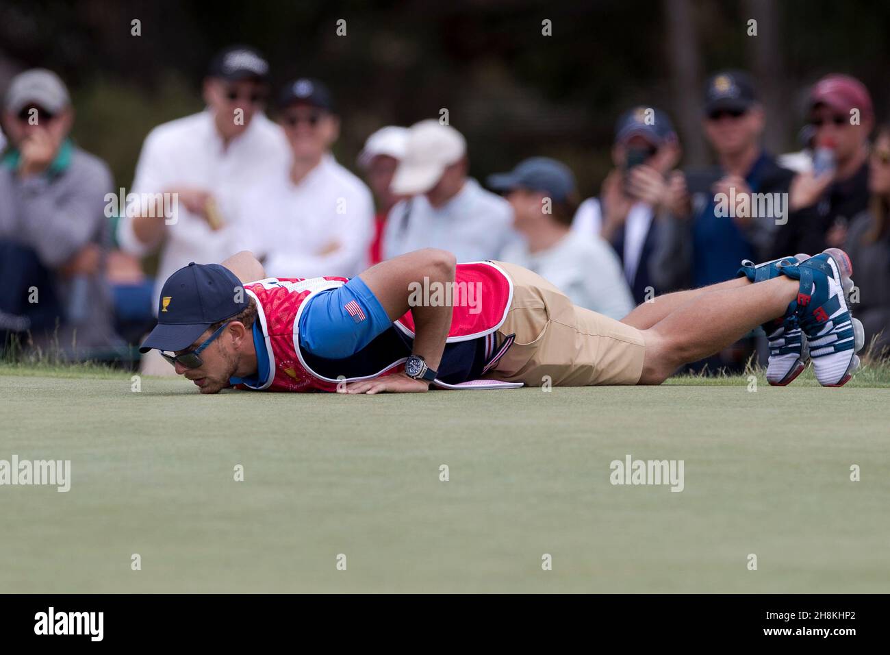Patrick Reed of team USA Caddie lines up a putt during round 2 of The ...