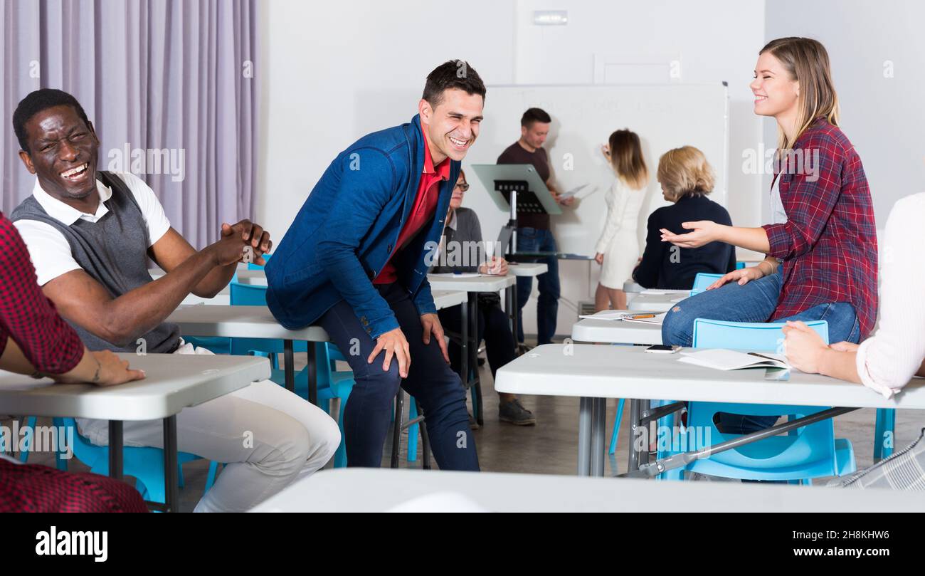 Adult students during recess Stock Photo - Alamy