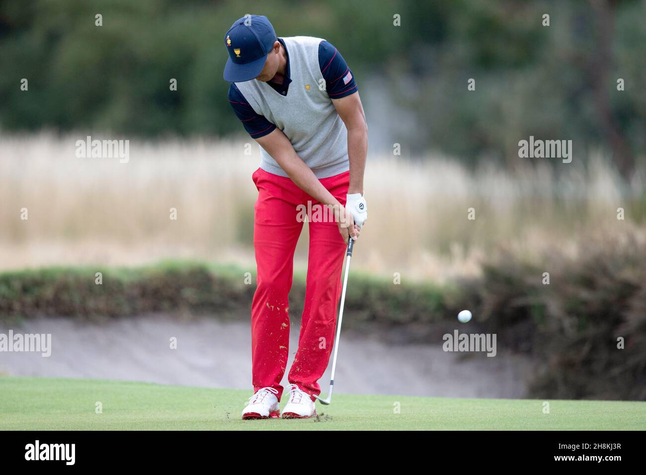 Rickie Fowler of team USA chips during round 3 of The Presidents Cup ...