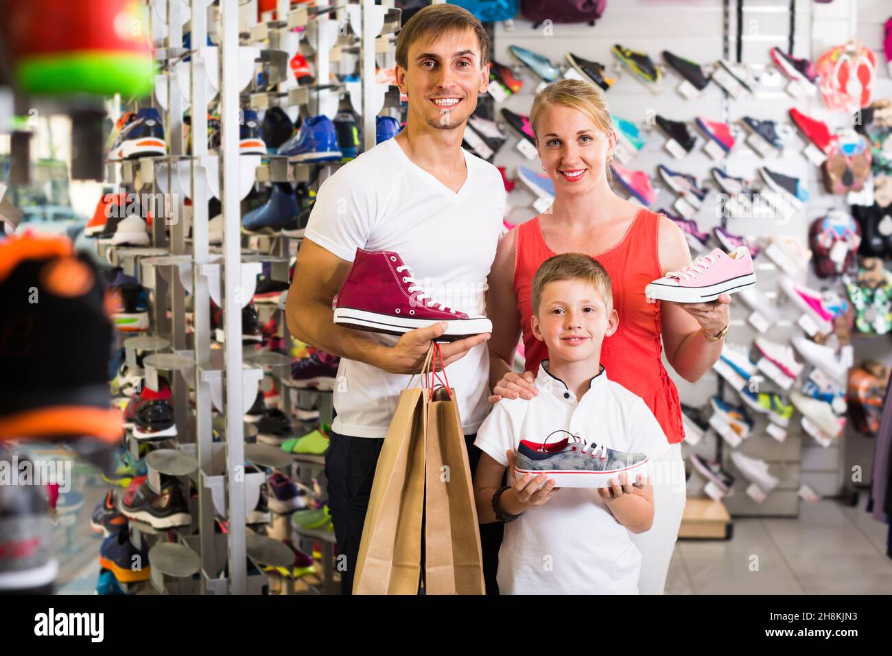 Young parents son sport store hi-res stock photography and images - Alamy