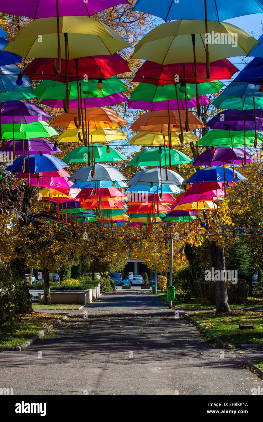 REGHIN, ROMANIA - Oct 26, 2021: An alley with hanging umbrellas in the ...