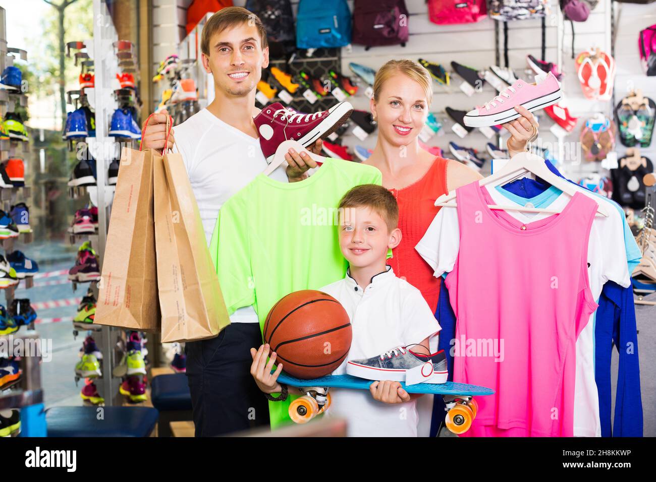 Family picking various clothing Stock Photo - Alamy