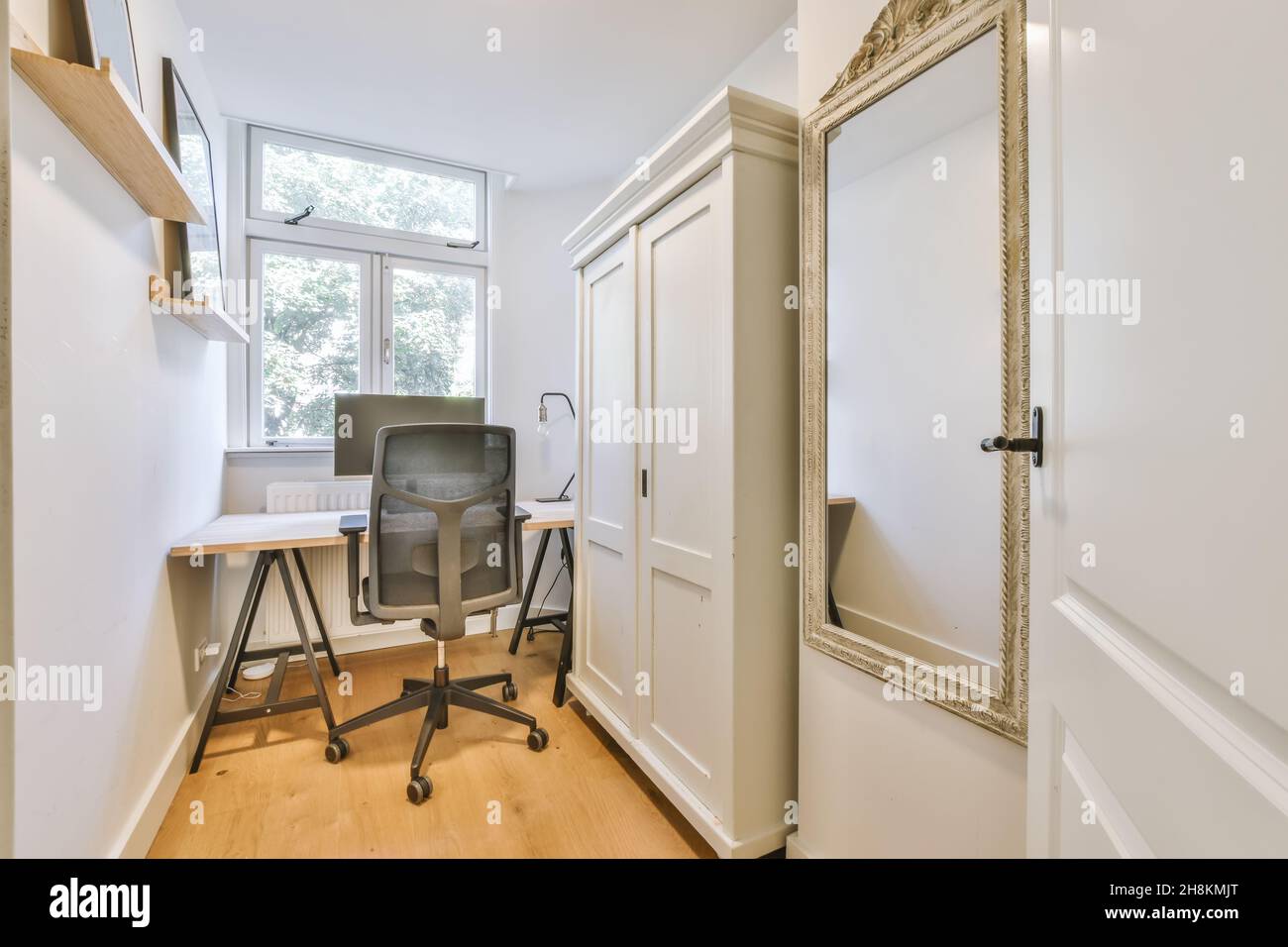 Small room with a miniature window and a desk for office work Stock ...