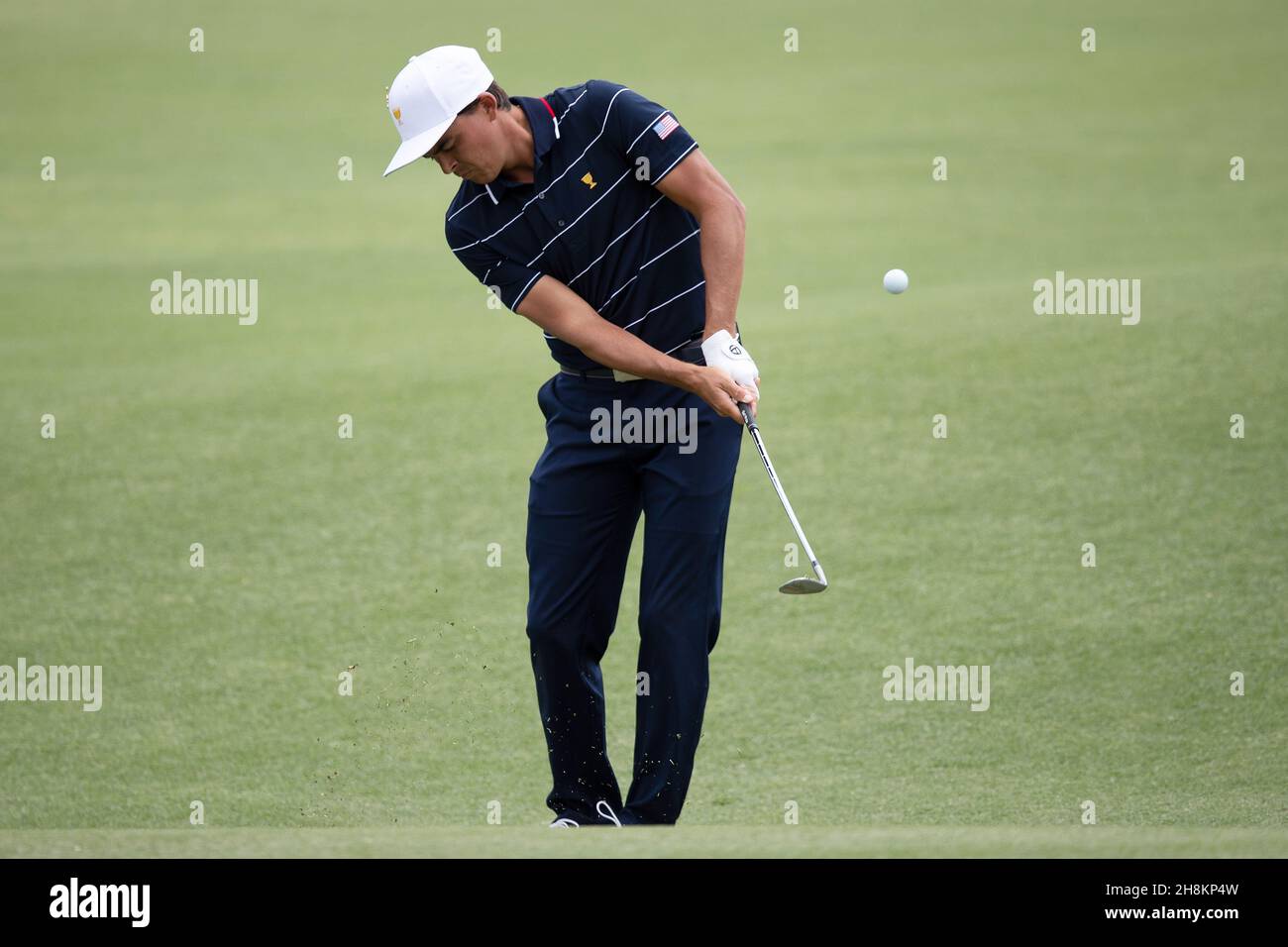 Rickie Fowler of team USA chips during The Presidents Cup practice ...