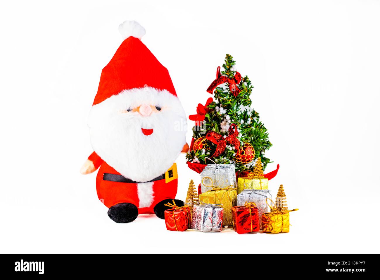 Generic soft toy of Santa Clause with Christmas tree and gifts on white ...