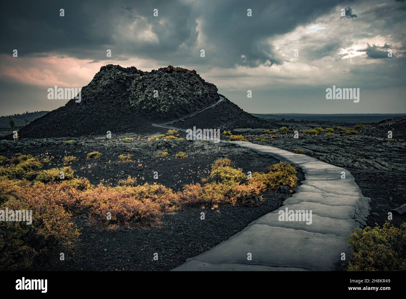 View of the spray cone trail on the horizon, lava hills, volcanic ...