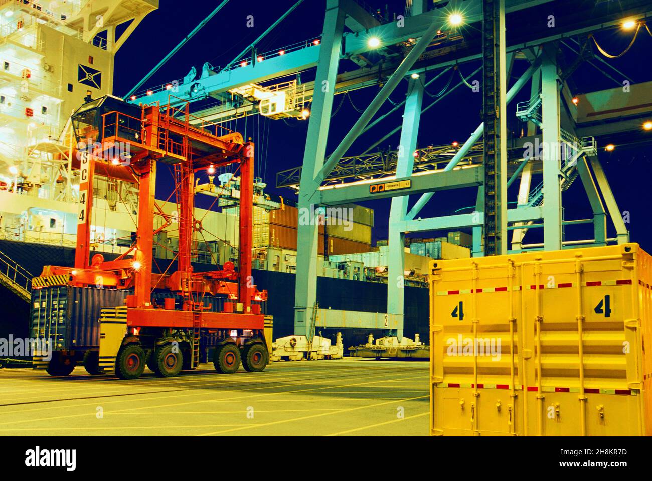 Gantry crane, straddle carrier, container. Shipping terminal wharf or ...