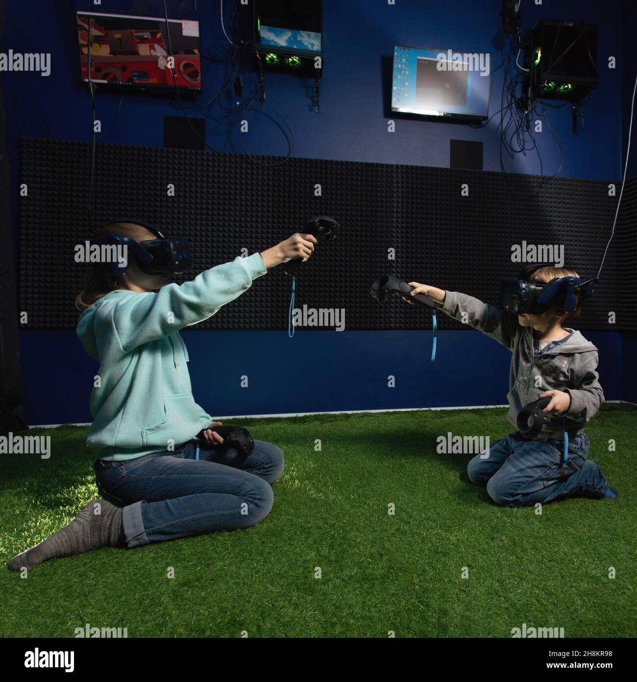 amazed children using virtual reality headsets and controllers build ...