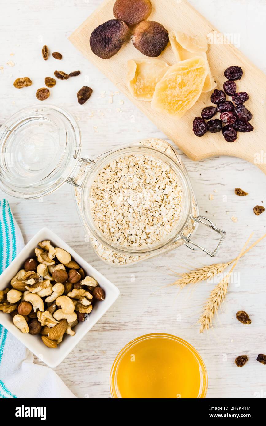 Top view of raw ingredients for homemade granola preparation - oats ...