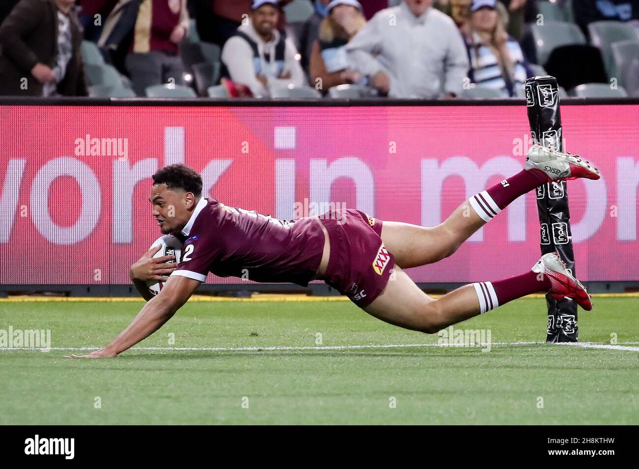Xavier Coates of the QLD Maroons scores a try during game one of the ...