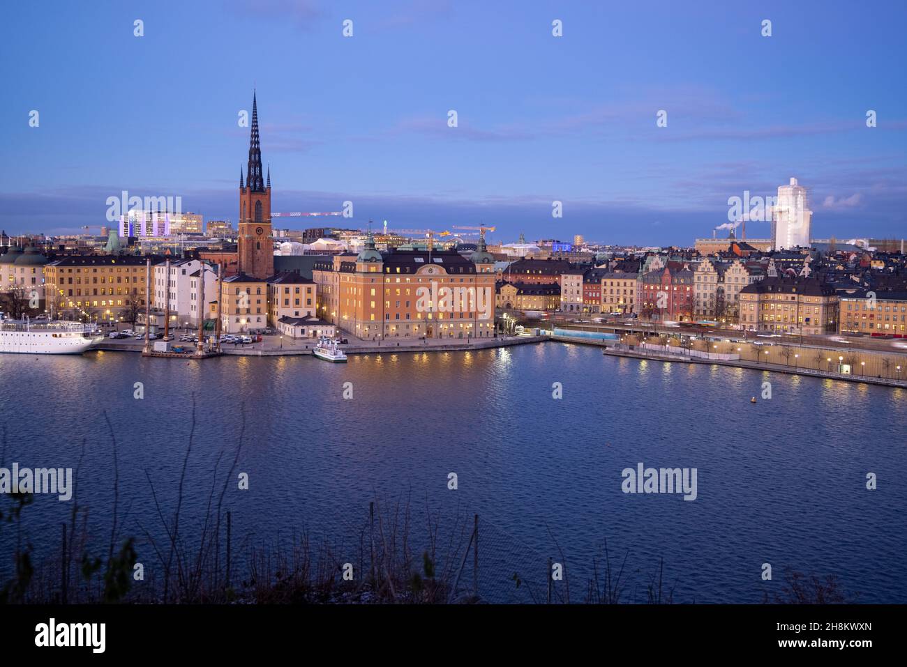 Beautiful panorama of Stockholm at night with sea, buildings, boats and ...