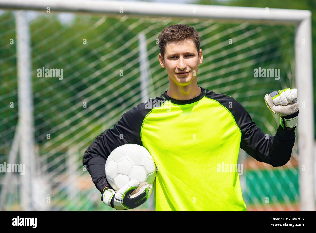 Portrait man Goalkeeper soccer man with ball Stock Photo - Alamy