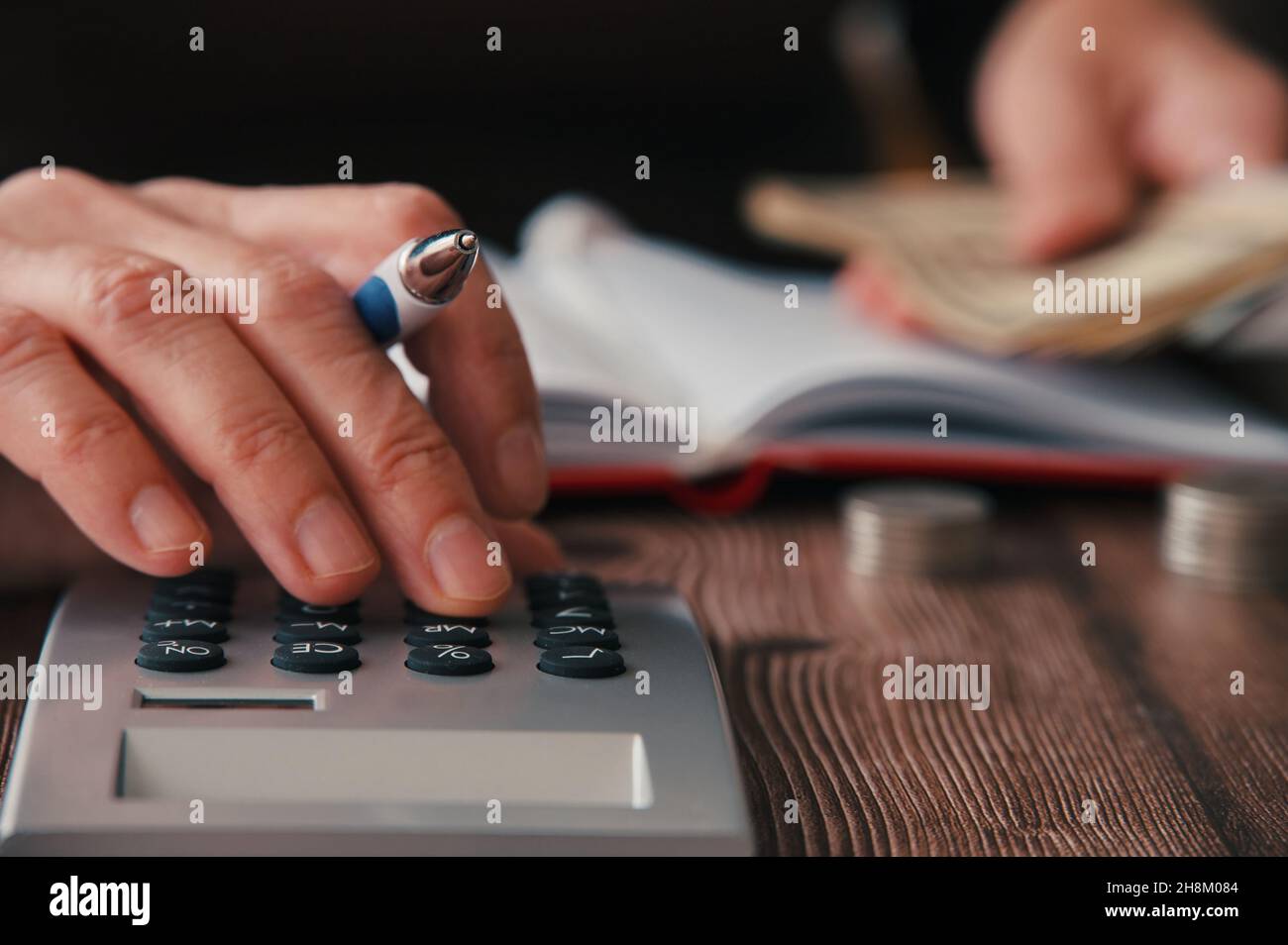 Closeup of senior woman using calculator to calculate numbers - finance ...