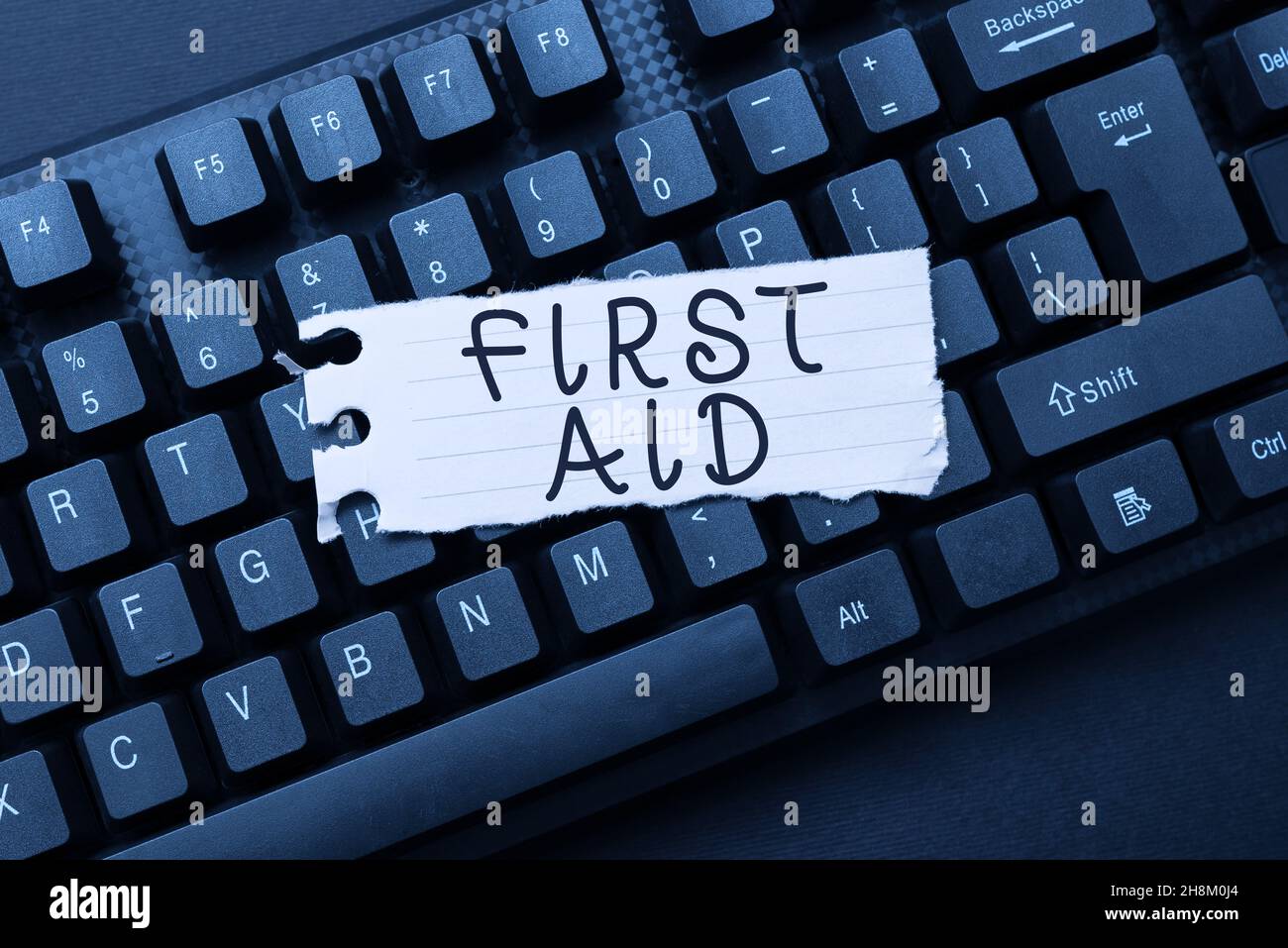 Hand writing sign First Aid. Concept meaning Practise of healing small ...