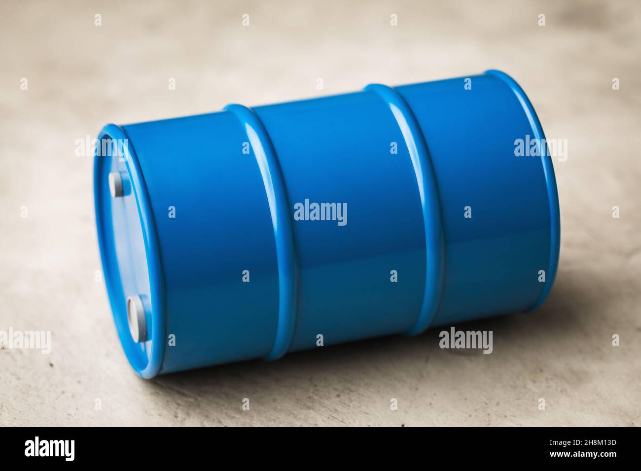 A blue barrel lying on its side, a barrel of oil Stock Photo - Alamy
