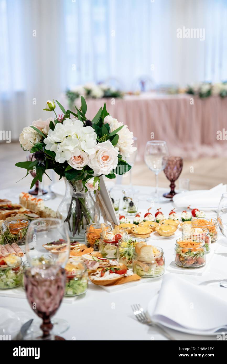 Flower decoration for wedding catering table in powdery pink color ...