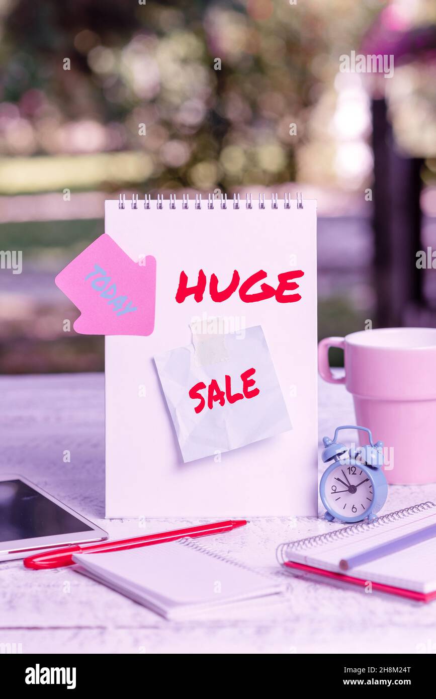 Sign displaying Huge Sale. Business showcase putting products on high ...
