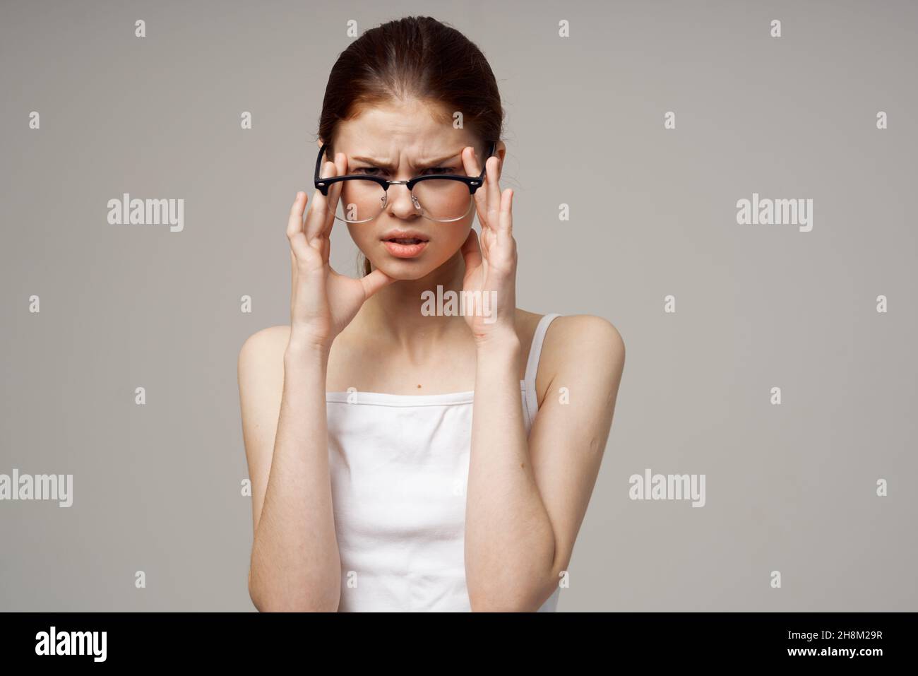 Woman squinting to read hi-res stock photography and images - Alamy
