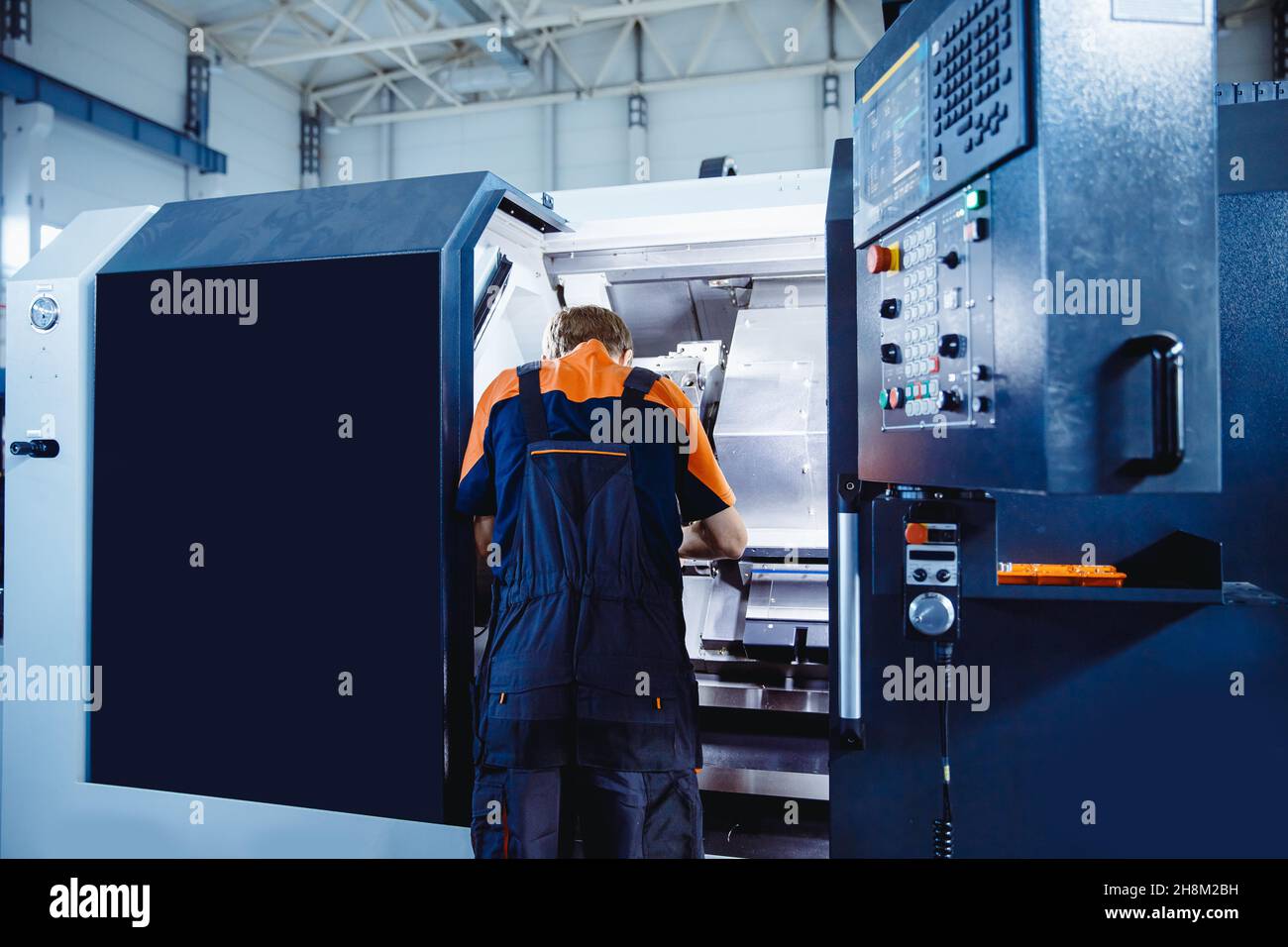 Portrait male engineer operating cnc hi-res stock photography and ...