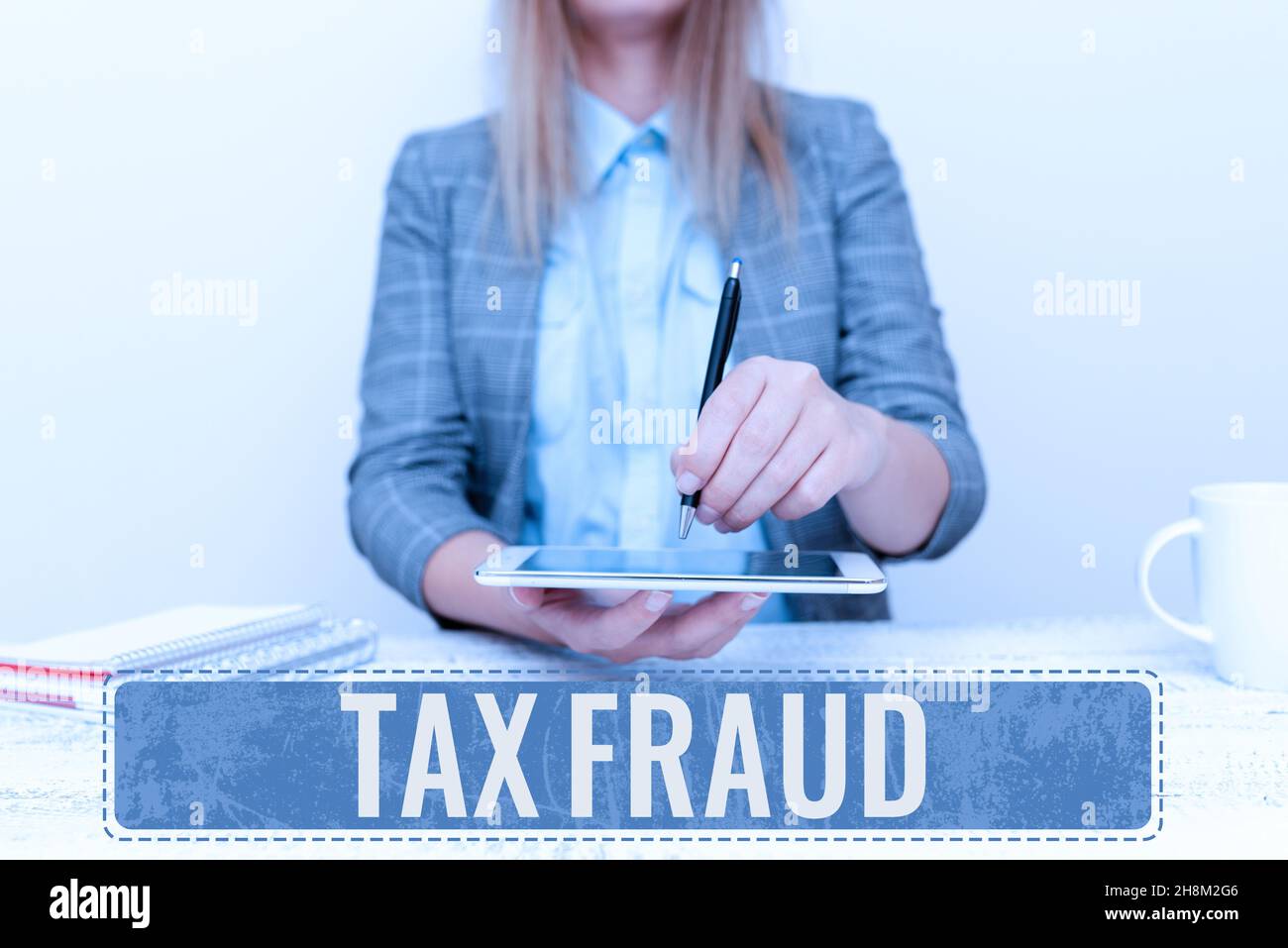 Hand writing sign Tax Fraud. Business approach entails cheating on a ...