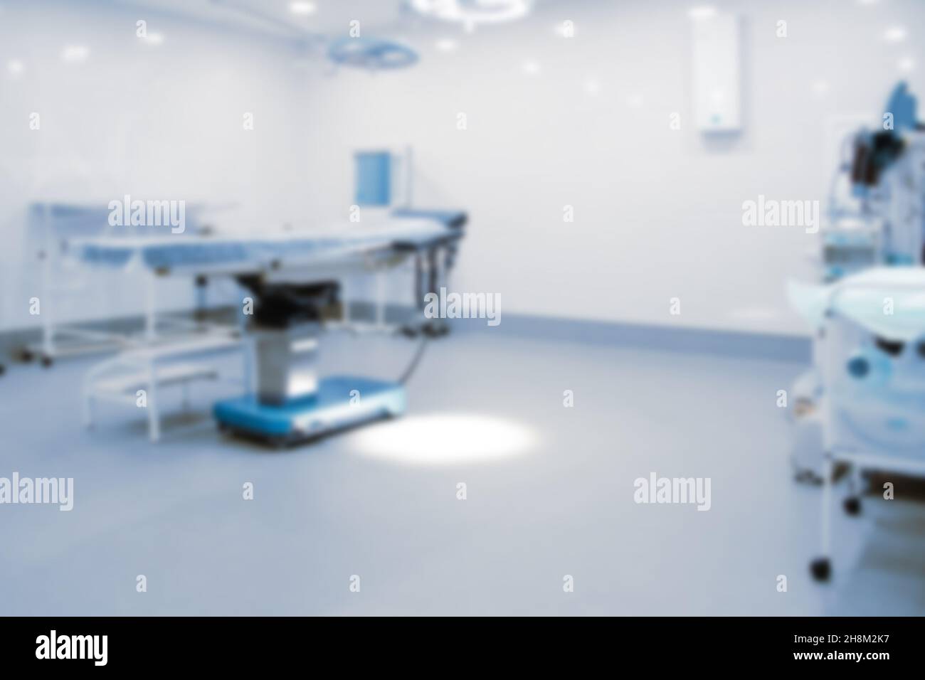 Blurry empty interior operating room and modern equipment in hospital ...