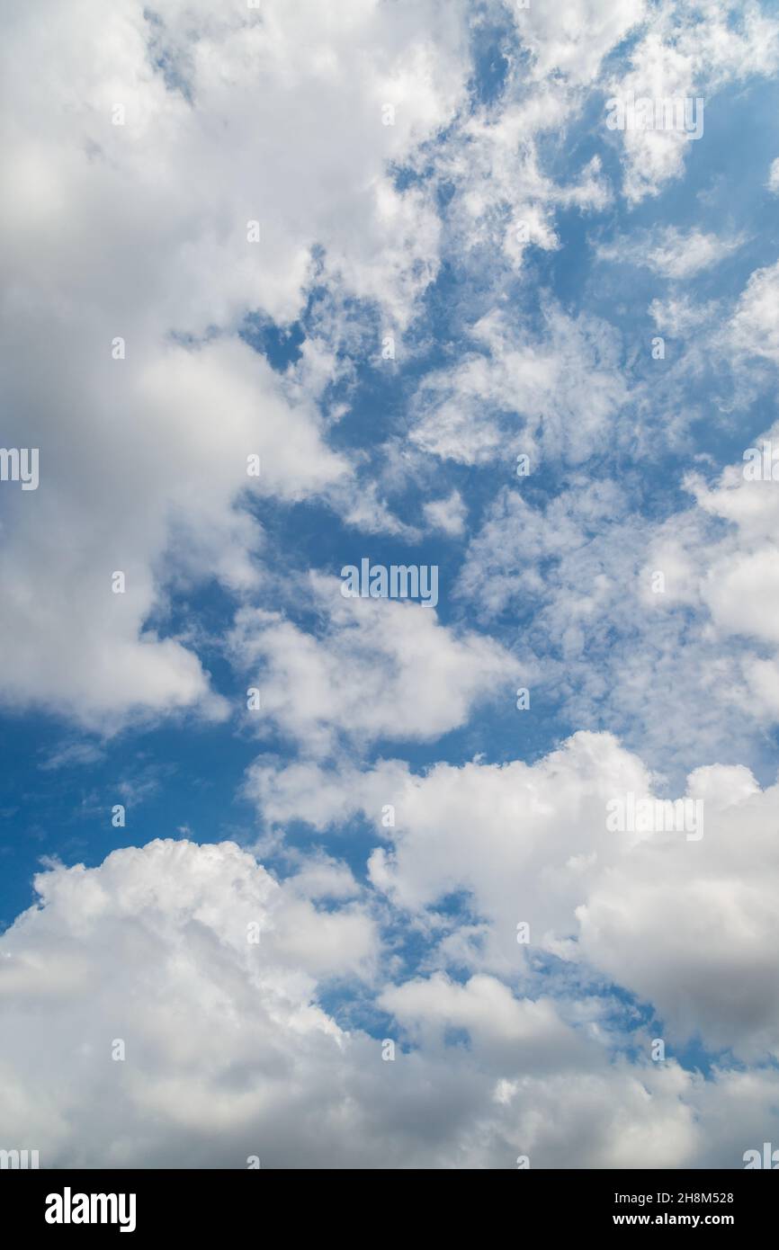 White sparse clouds over blue sky background Stock Photo - Alamy