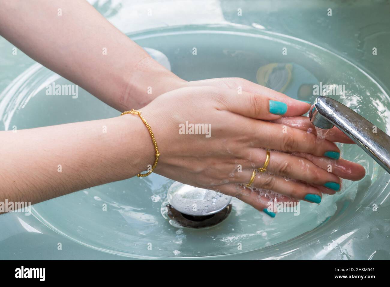 Washing of hands with soap under running water Stock Photo - Alamy